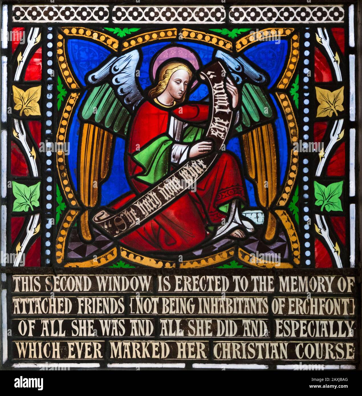 Victorian stained glass window detail depicting an angel holding ...