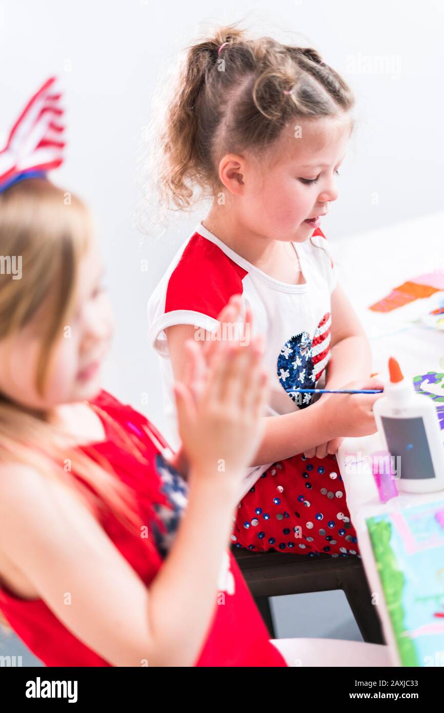 Little girls are painting on canvas on July 4th party Stock Photo - Alamy