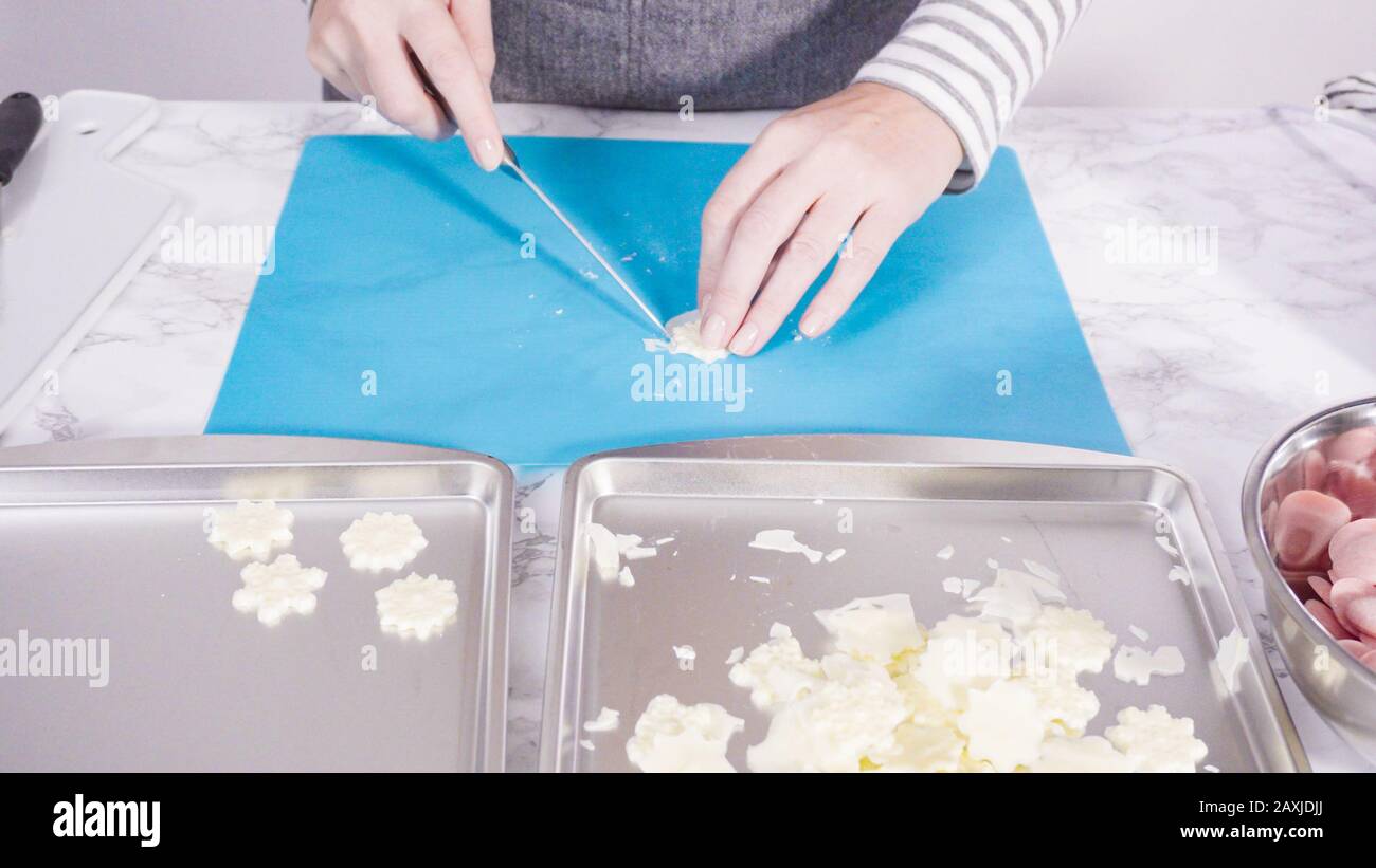 Step by step. Trimming excess chocolate with a small kitchen knife from ...