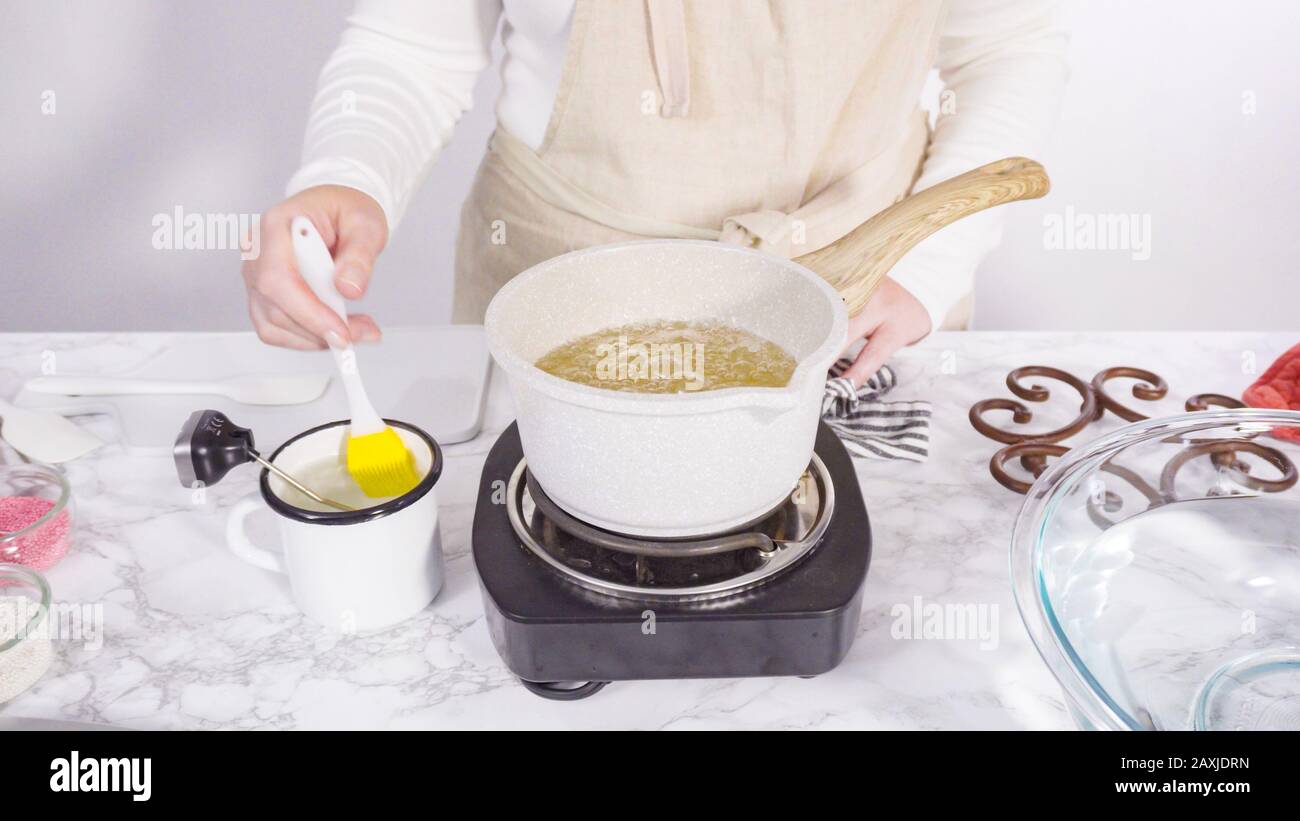 Step by step. Caramelizing sugar in a small cooking pot over the small ...
