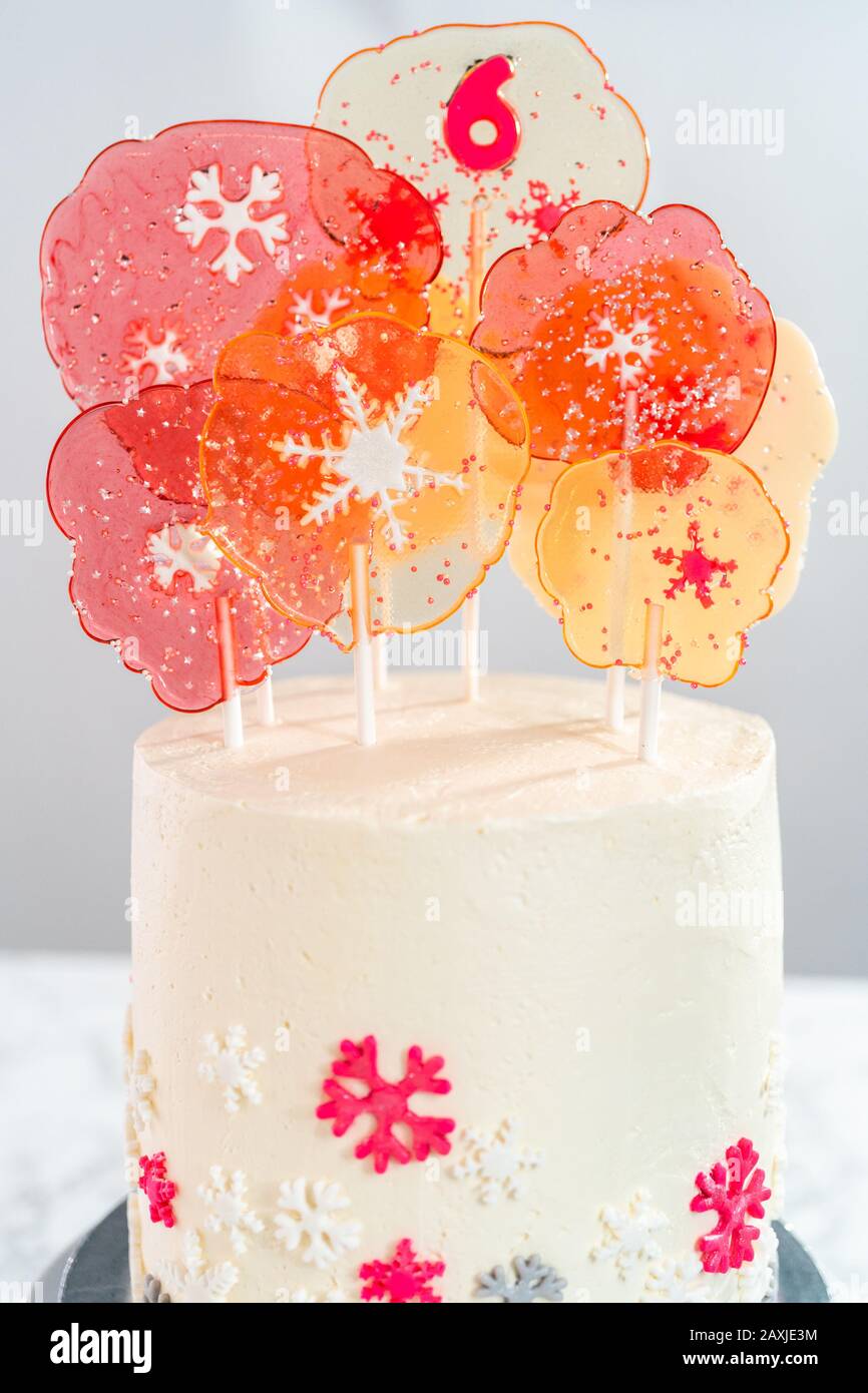 Tall round cake with Italian buttercream frosting decorated with ...