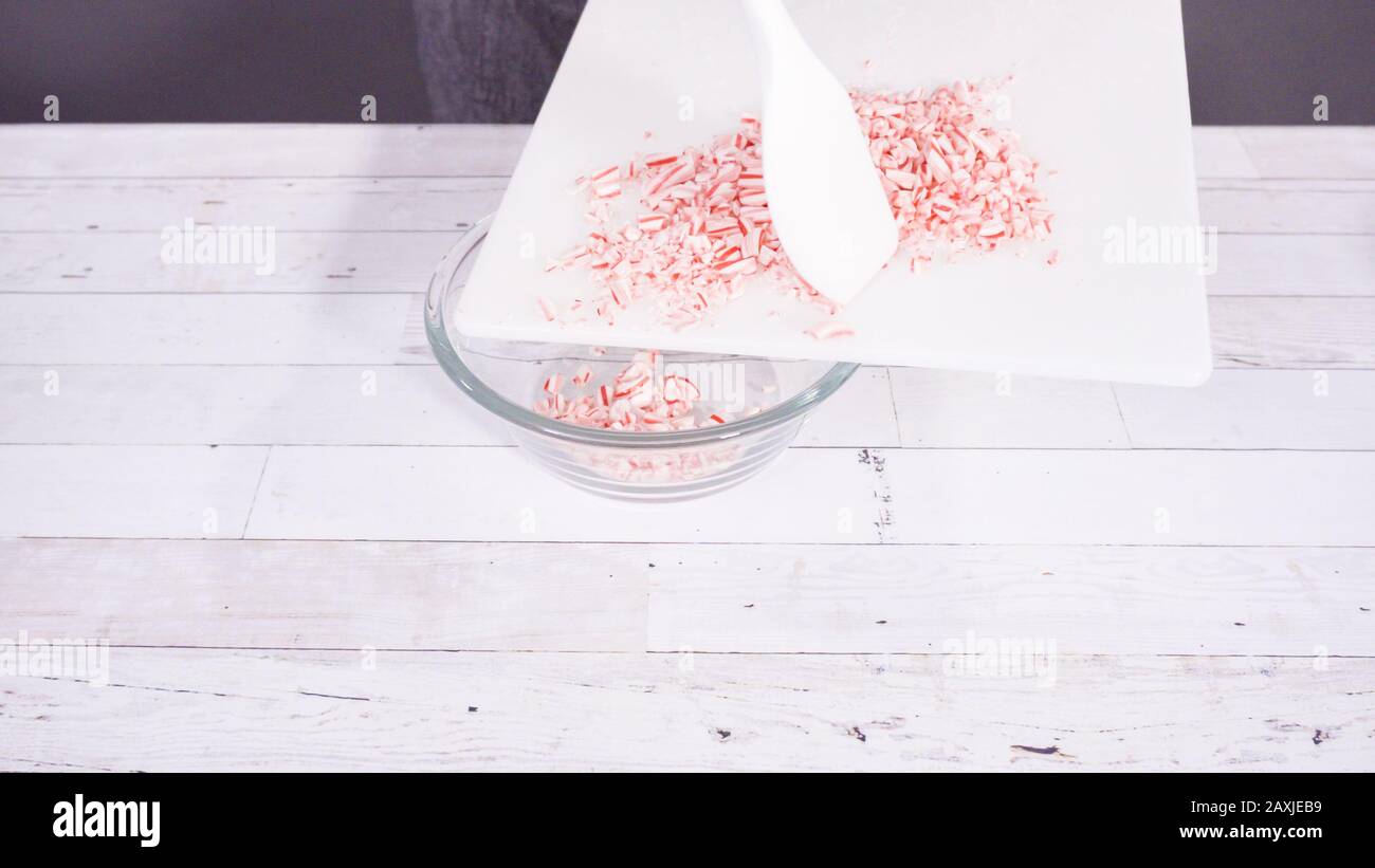 Step by step. Breaking candy cane candies into small pieces Stock Photo ...