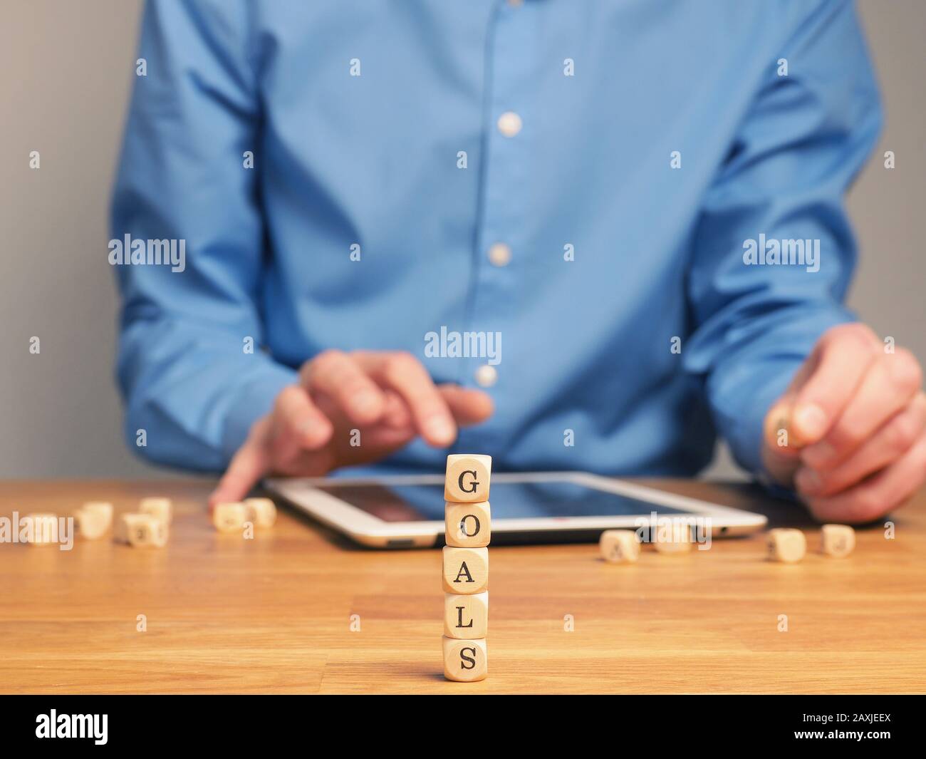 Business goals concept with small wooden blocks on an office table ...