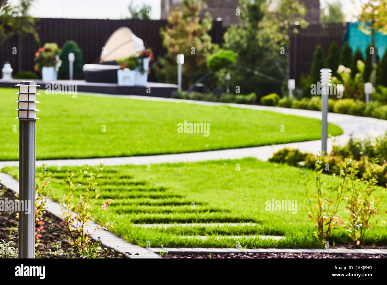 Beautiful clean lawn grass is bright green near the house neatly ...