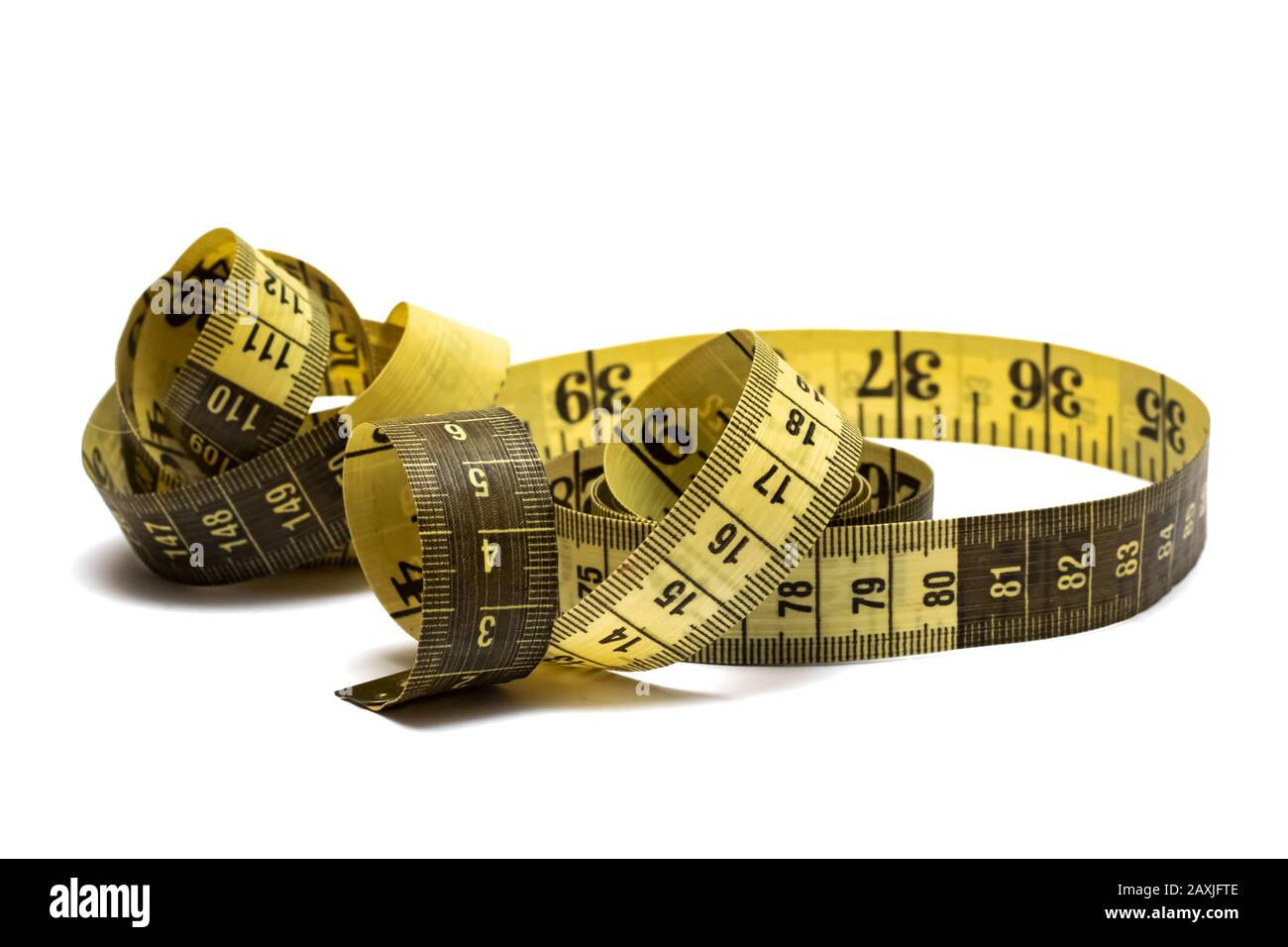 Twisted measuring tape isolated on white background Stock Photo - Alamy