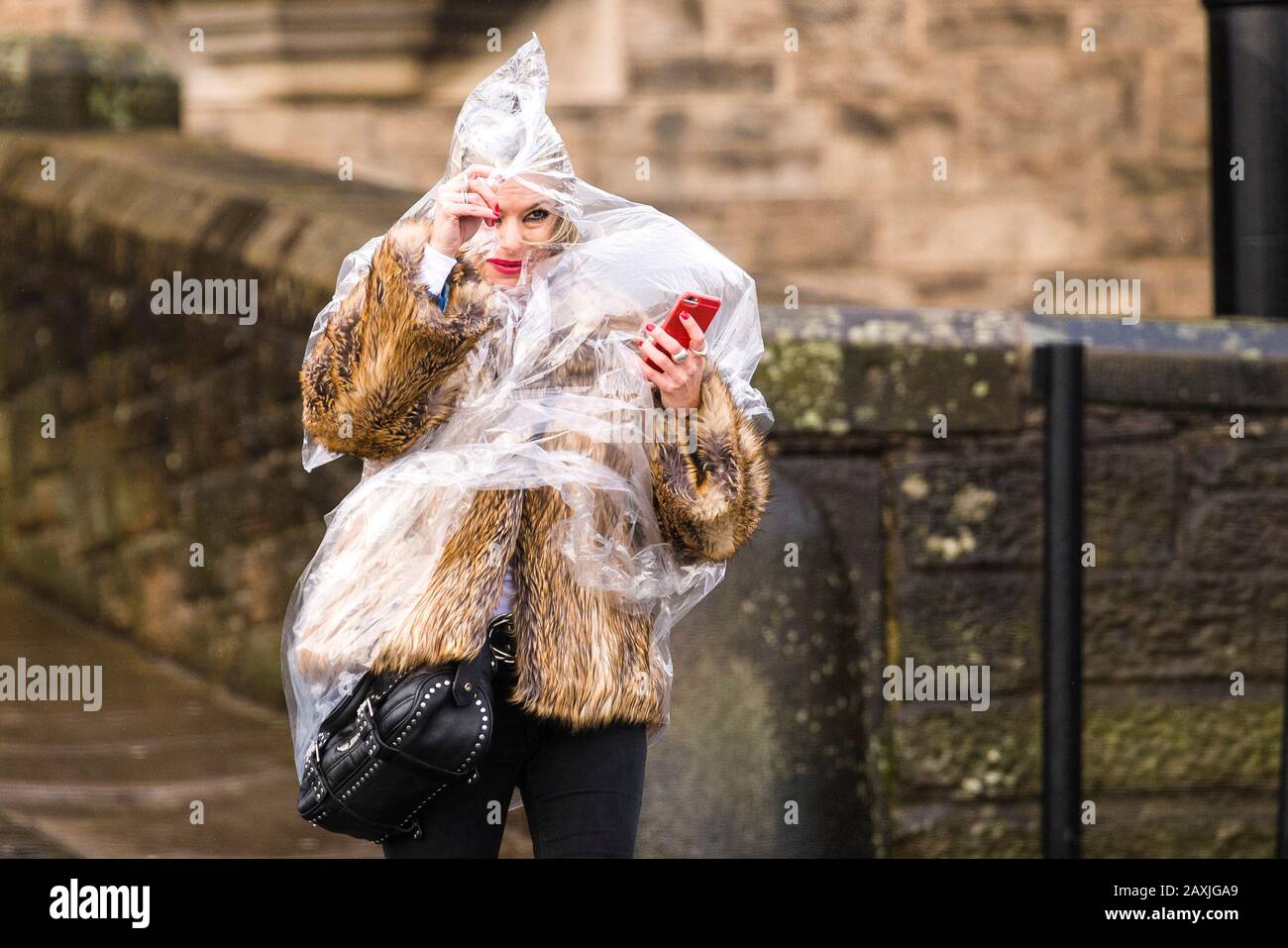 Edinburgh embraces strong winds and rain which see's Edinburgh castle ...