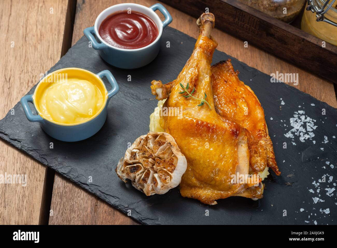 Grilled Chicken Thigh fine dining Dish Stock Photo - Alamy
