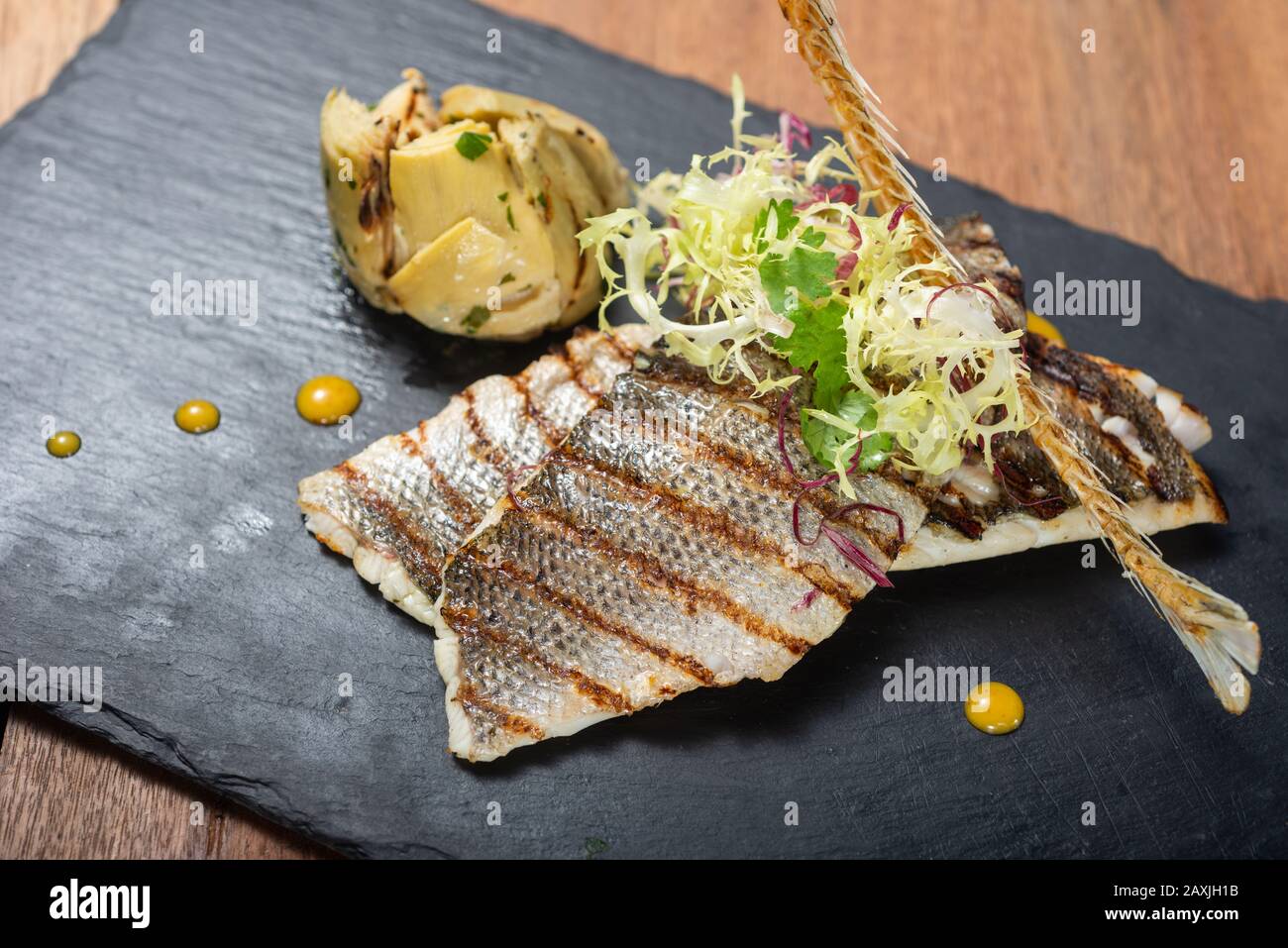 Fine Dining Fish dish on slate Stock Photo - Alamy