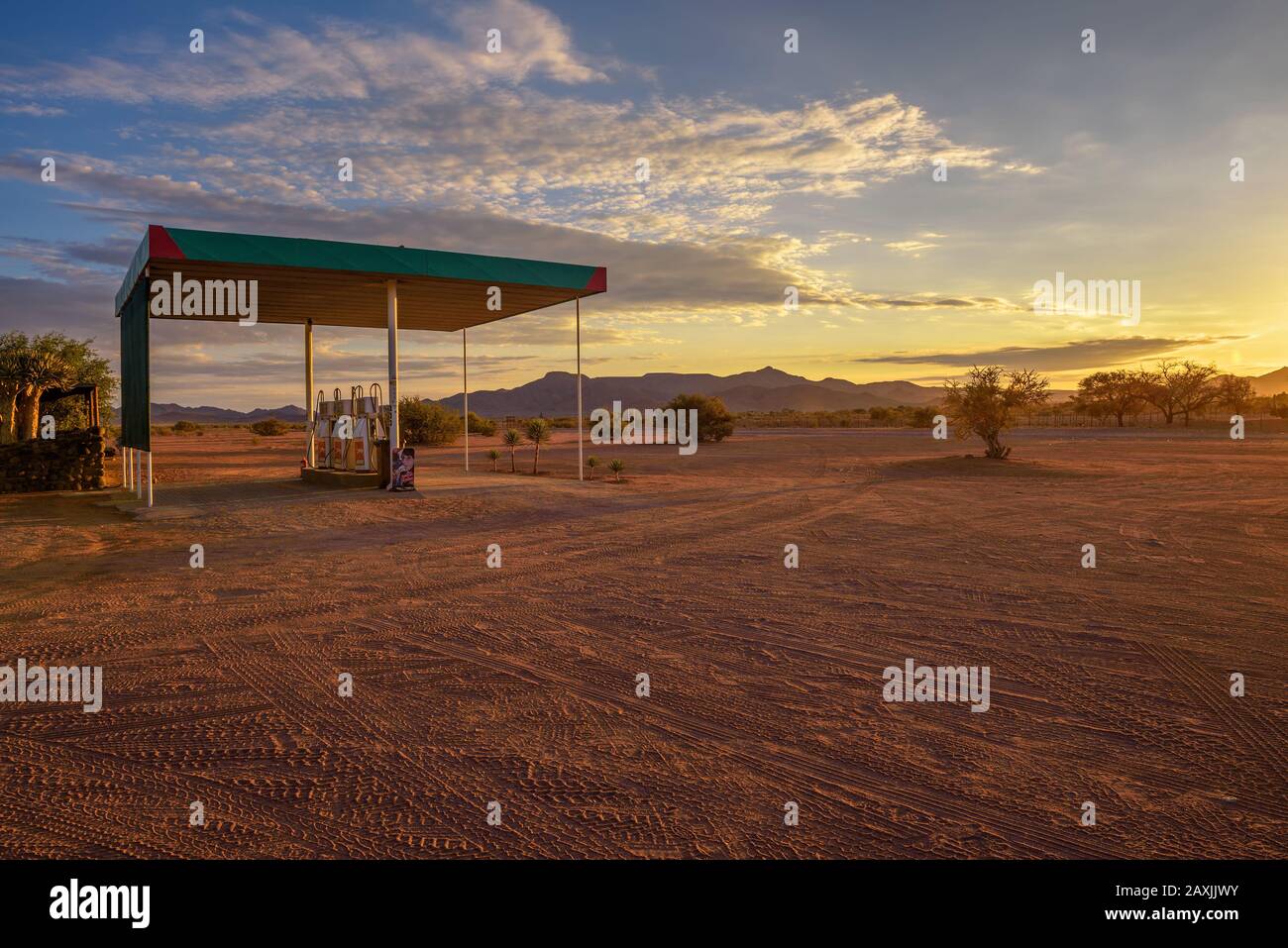 Puma gas station located on a dirt road in the Namib Desert at sunrise ...