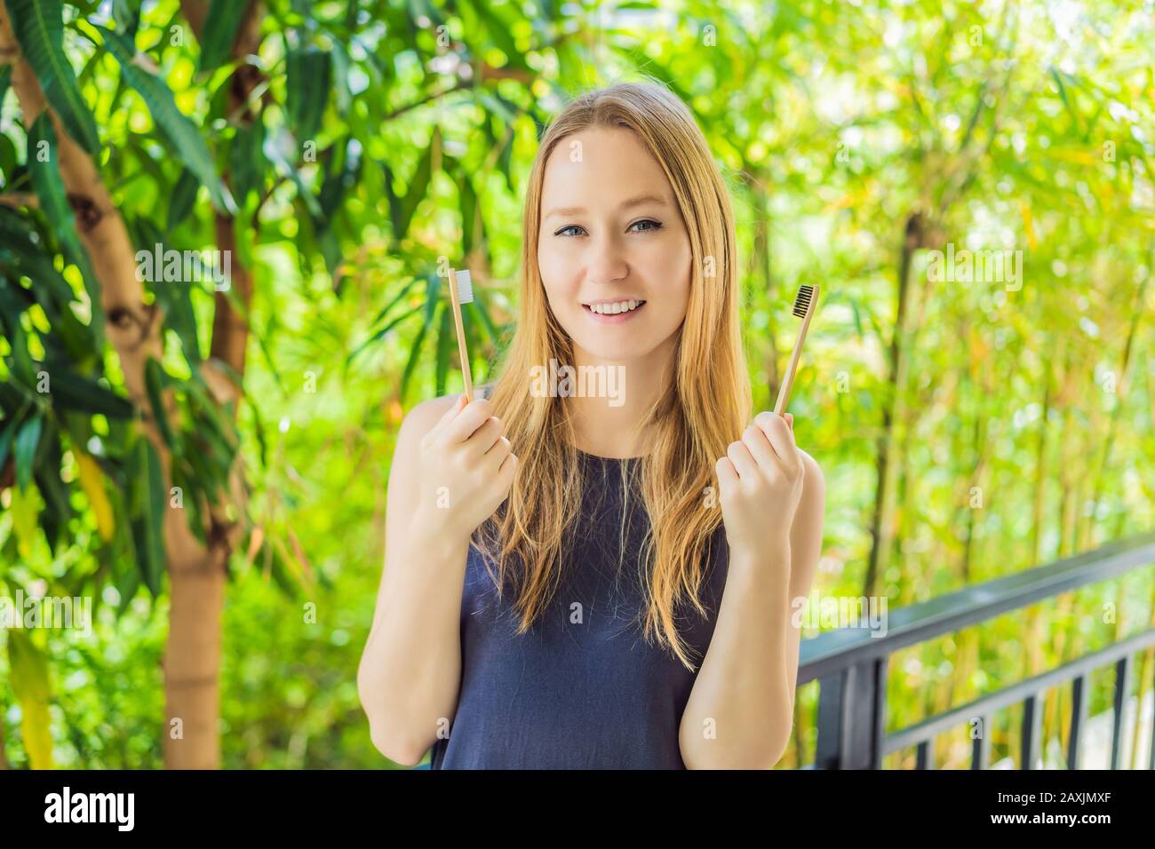 Woman holds bamboo toothbrush soda hi-res stock photography and images ...