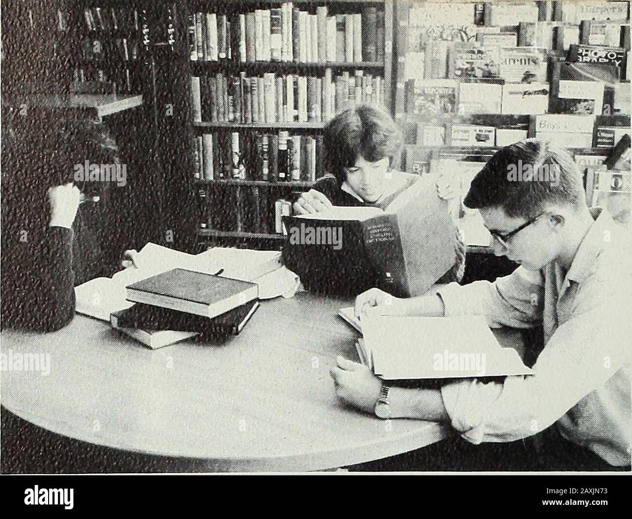 U and I Marilee Russell and Judy Green forget homework and dance in front of the juke box in the Lounge. 13 STUDYING As exam week approaches tensionmounts. Students study constantly at