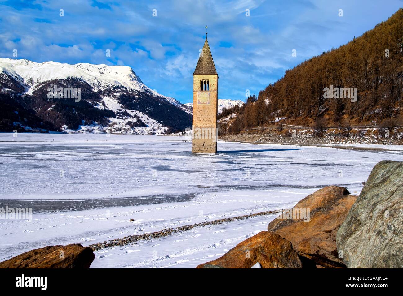 Winter landscape in the Alps with the famous sunken church tower in ...