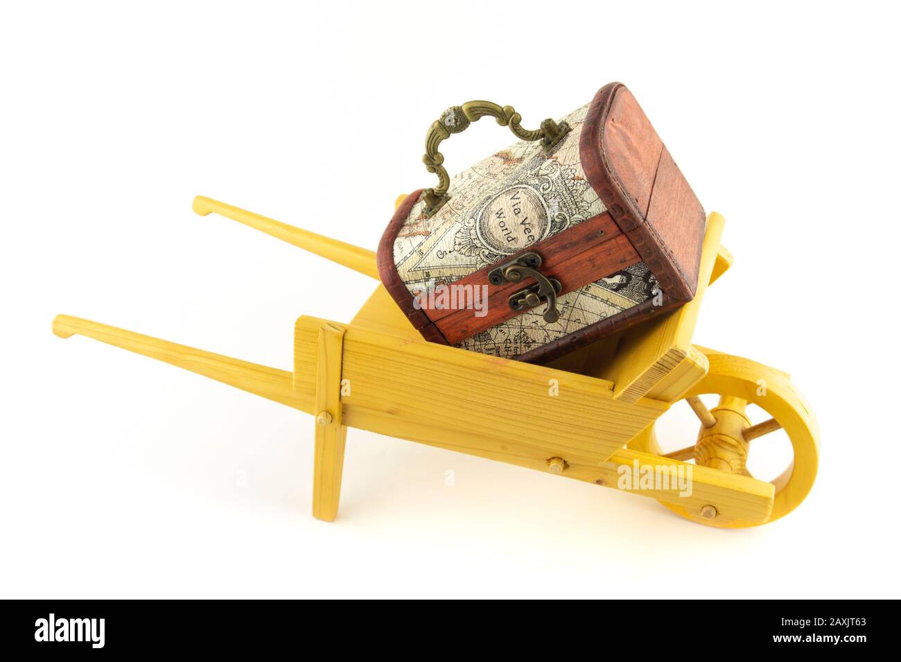 Small vintage case in a colorful wooden yellow wheelbarrow over white ...