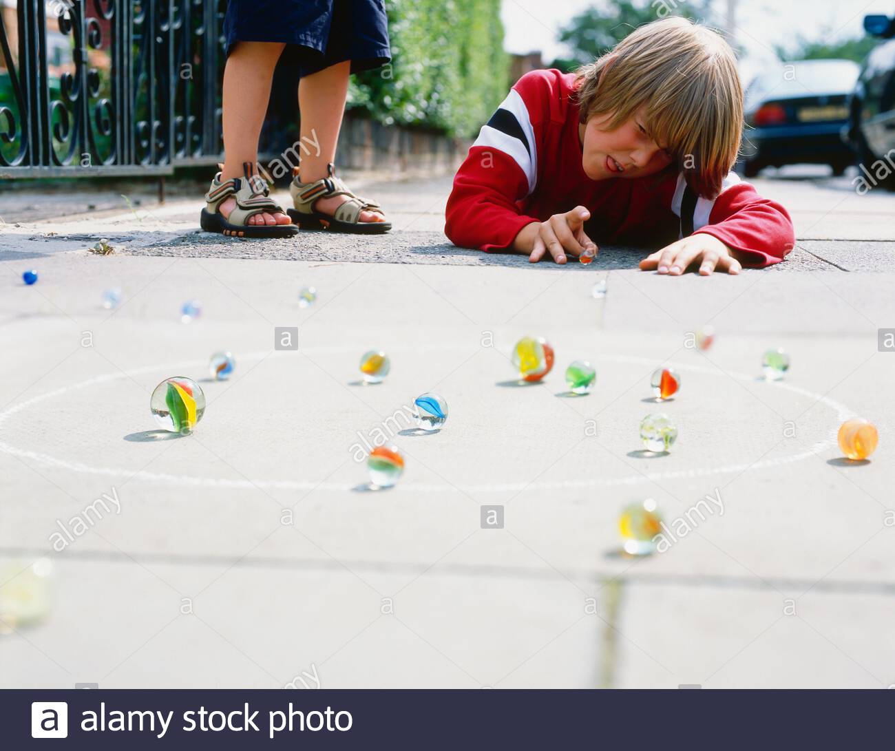 Boys Playing Marbles High Resolution Stock Photography and Images - Alamy