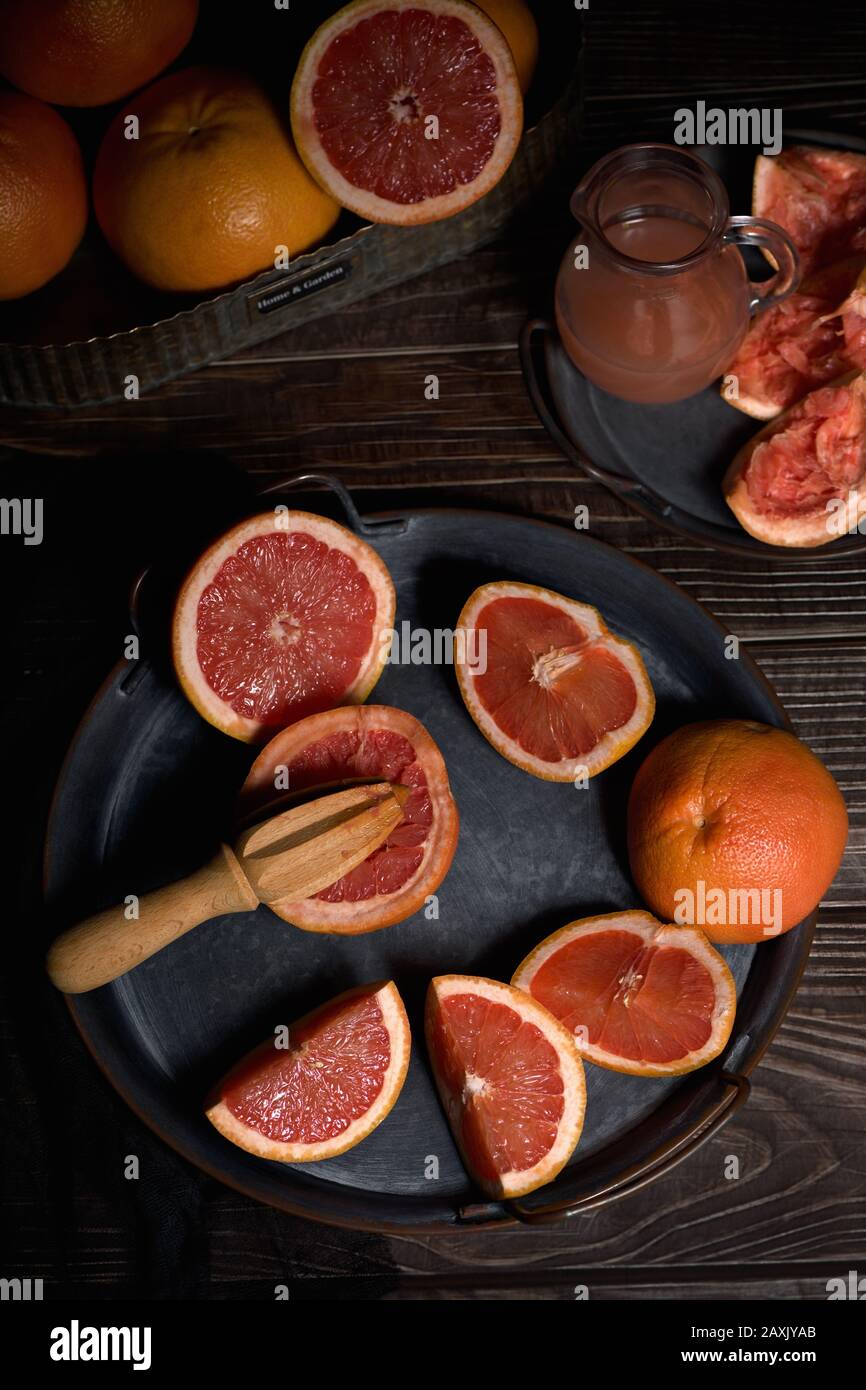 Slices of fresh grapefruit prepared for making fresh squeezed juice on ...