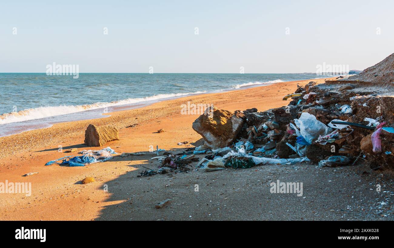 Heap of garbage on the beach, environmental pollution Stock Photo - Alamy