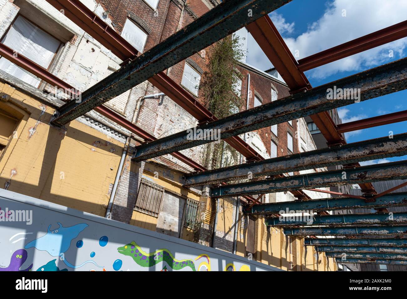 Weathered and rusting cross beams and girders. Exposed structural ...
