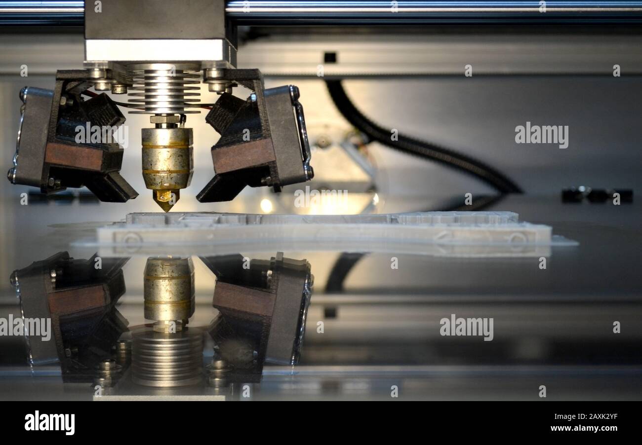 3D printer print isolated objects on mirror reflective surface close-up ...