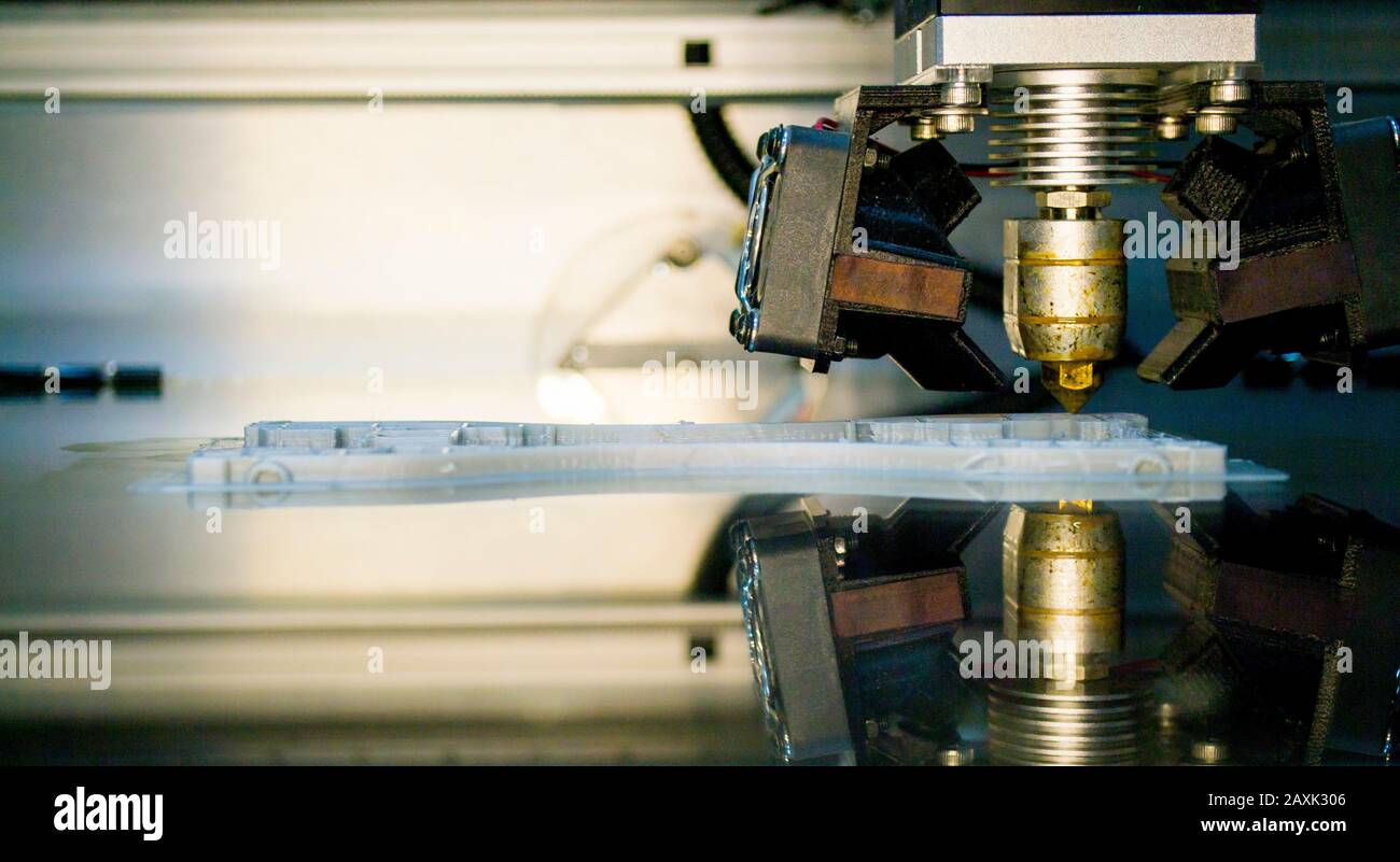 3D printer print isolated objects on mirror reflective surface close-up ...
