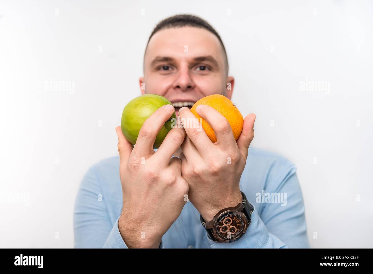Man hold apple hi-res stock photography and images - Alamy
