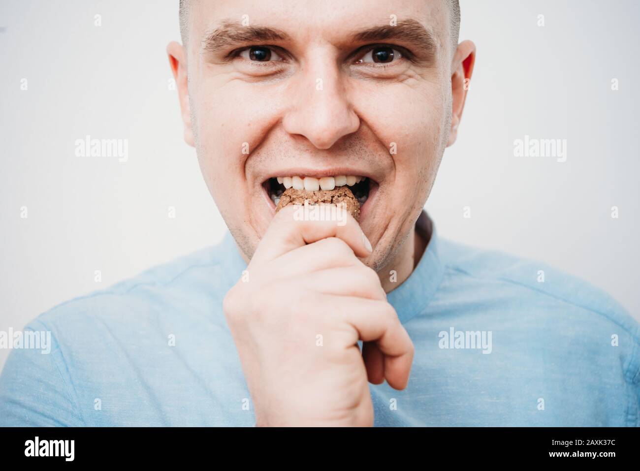 Man eating chocolate hi-res stock photography and images - Alamy