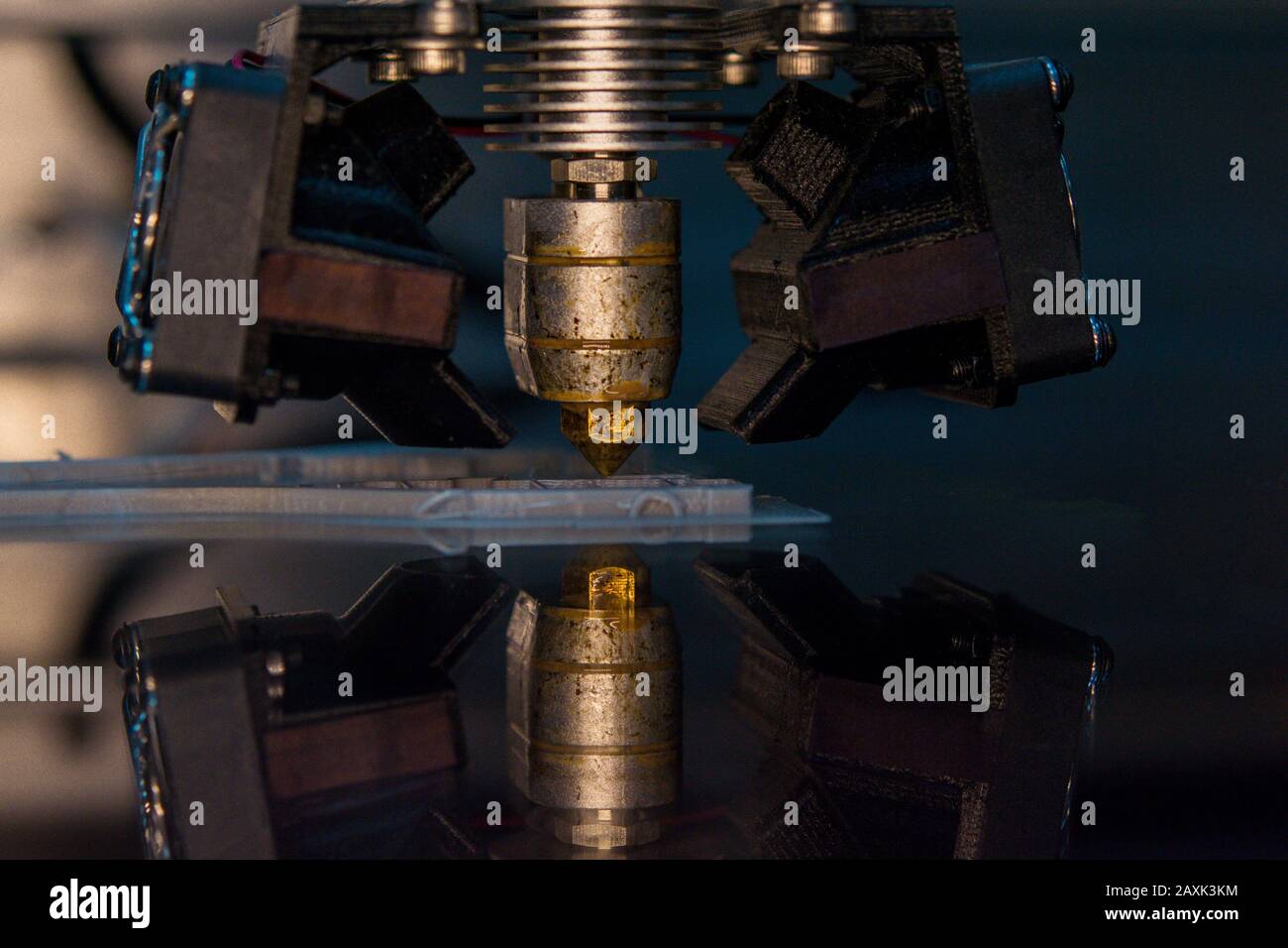 3D printer print isolated objects on mirror reflective surface close-up ...