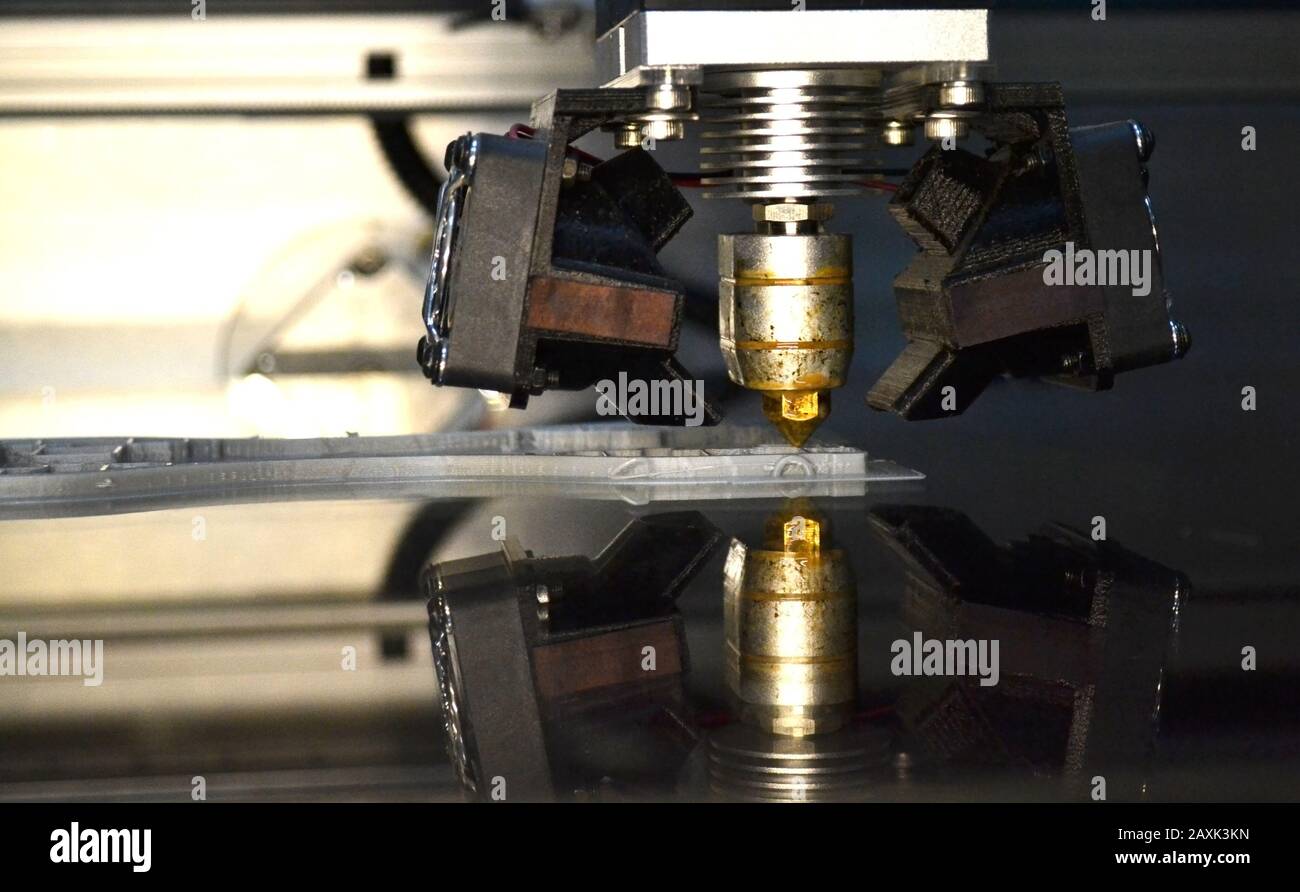 3D printer print isolated objects on mirror reflective surface close-up ...