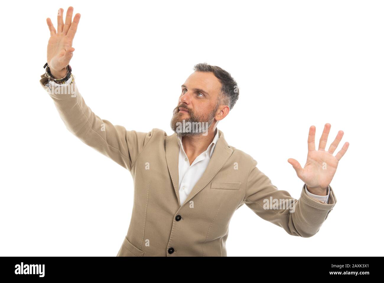 Portrait of handsome man wearing smart casual clothes touching ...