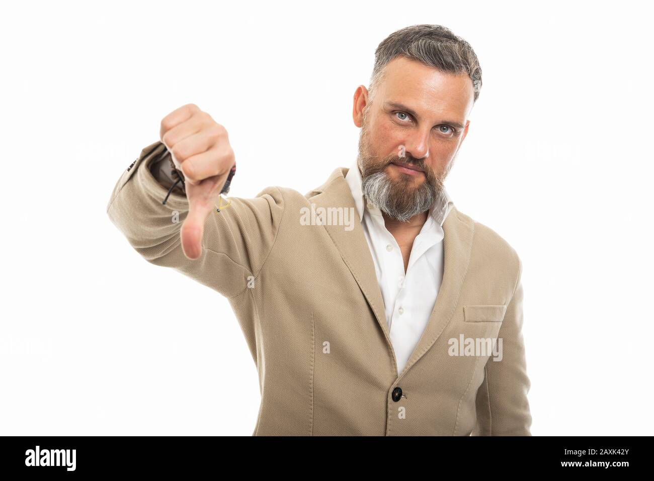 Portrait of man wearing smart casual clothes showing dislike gesture ...