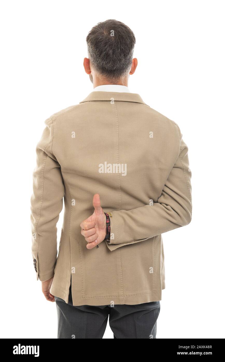 Back view of man wearing fashionable clothes showing like gesture ...