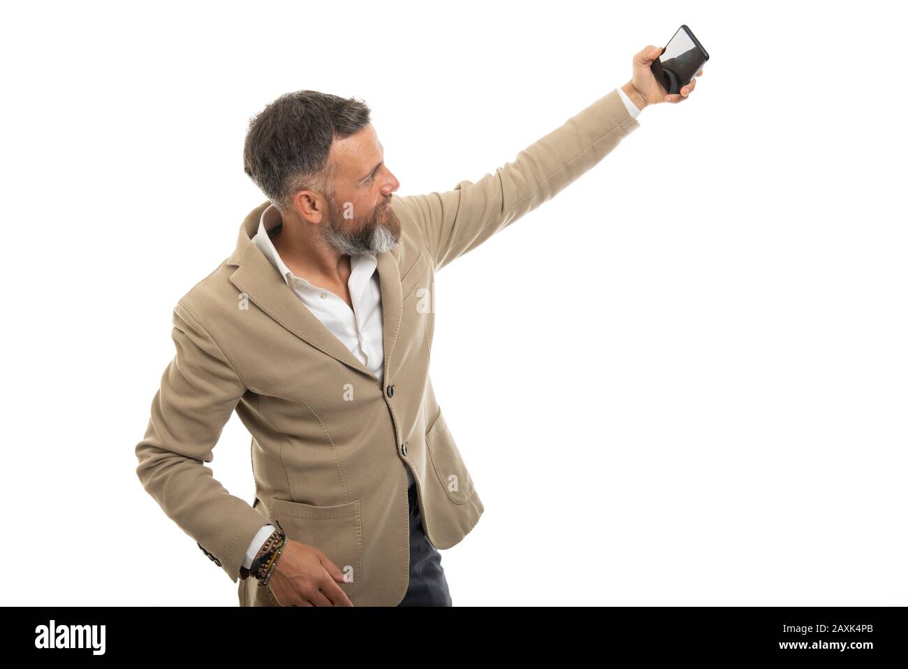 Man wearing smart casual clothes taking selfie with smartphone isolated ...