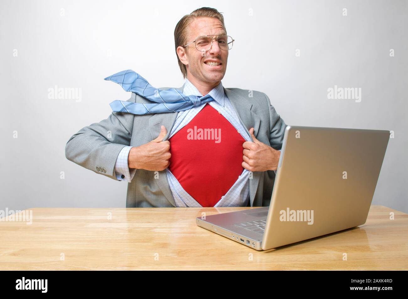 Superhero tech businessman giving a cheeky wink to the camera as he ...