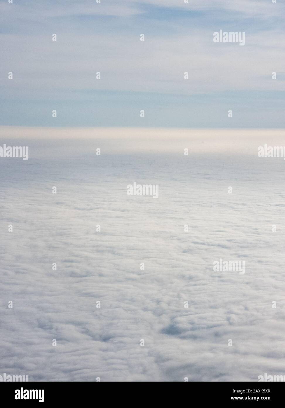 View from an airplane above the clouds during blue hour Stock Photo - Alamy