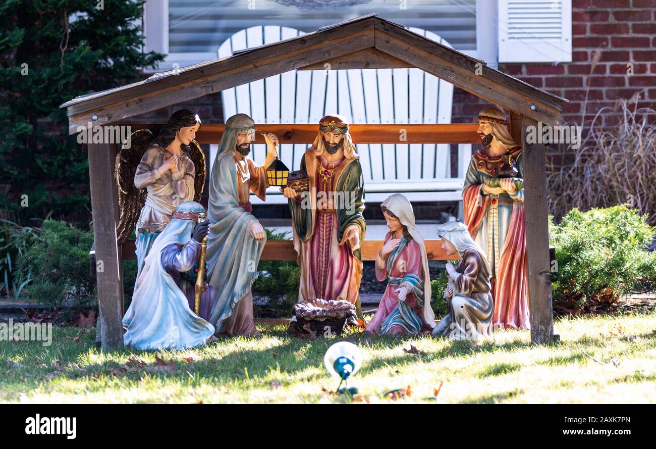 A Christmas nativity decoration on a front lawn celebrating the holiday ...