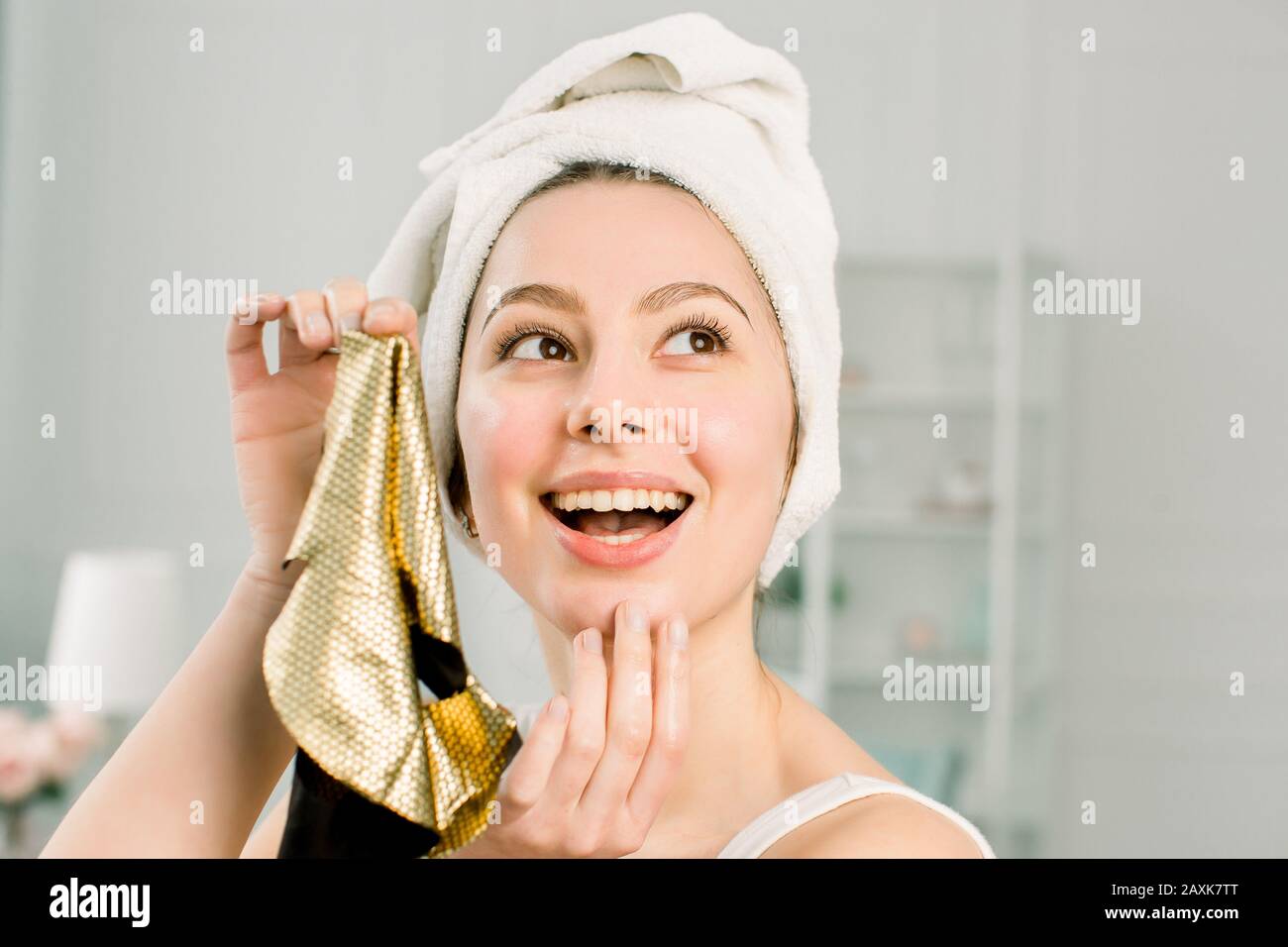 Portrait Of Attractive Smiling Young Woman Removing Golden Mask From ...