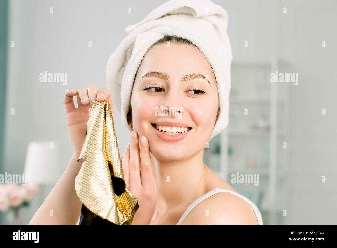 Portrait Of Attractive Smiling Young Woman Removing Golden Mask From ...