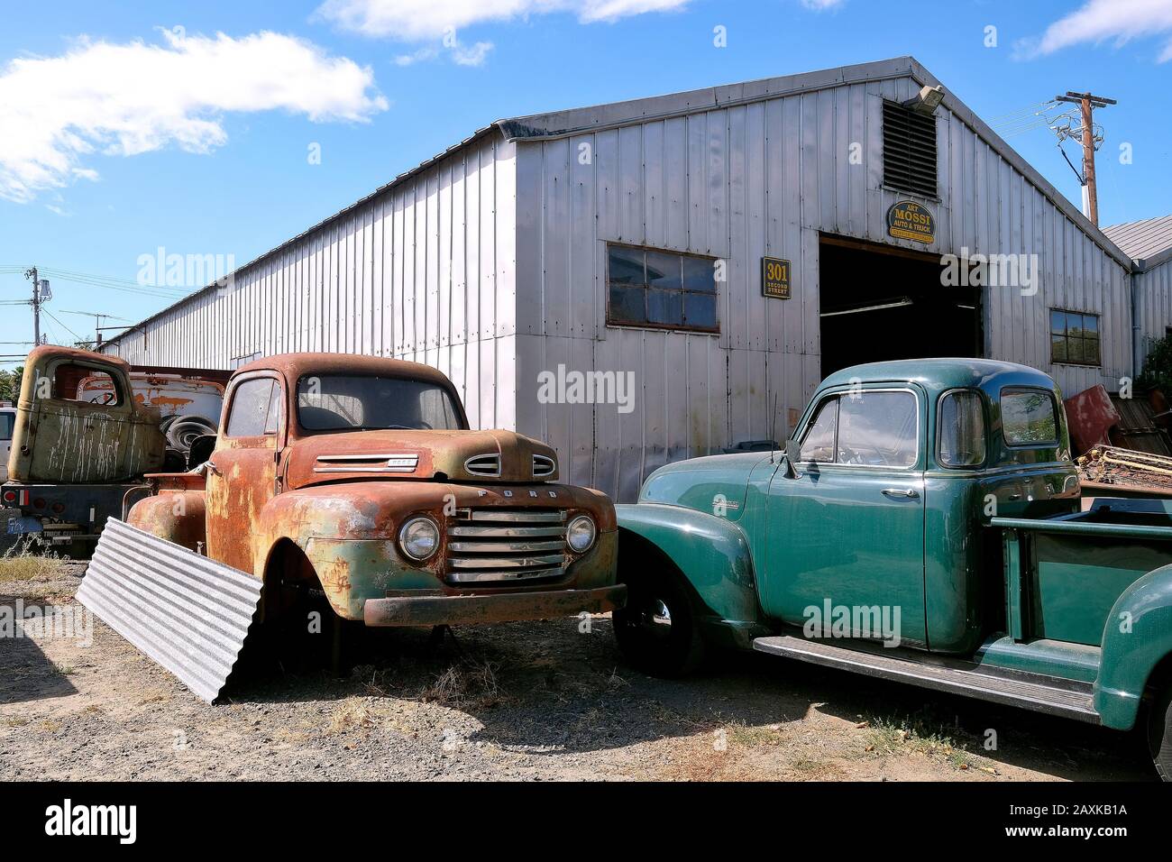 Old pickup trucks in front of a garage, Petaluma, California, USA Stock ...