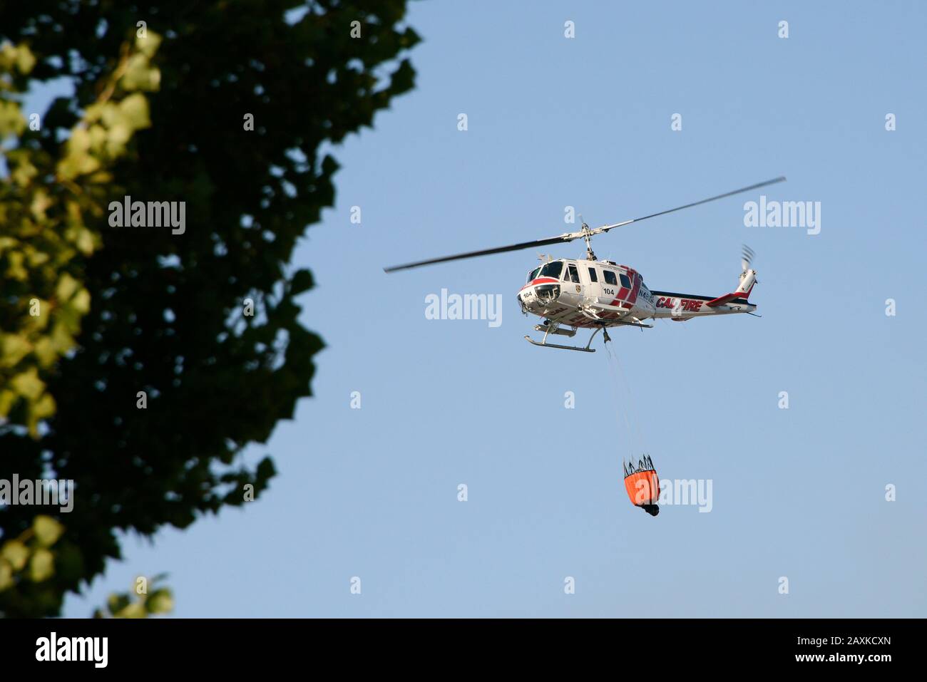 California Cal Fire Department helicopter transports fire-fighting ...