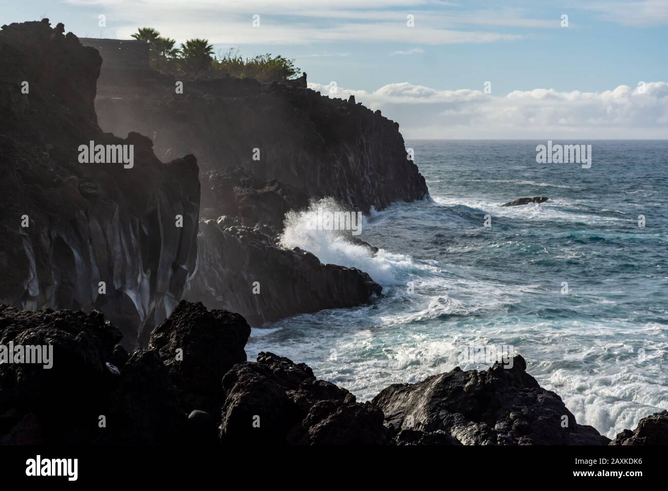 Dangerious ocean stormy waves hits black lava rocks on La Palma island ...