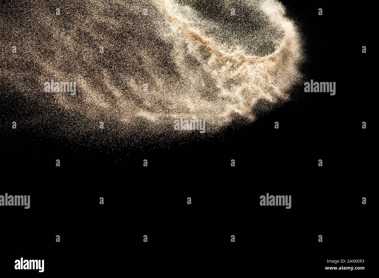 Brown colored sand splash.Dry river sand explosion isolated on black ...