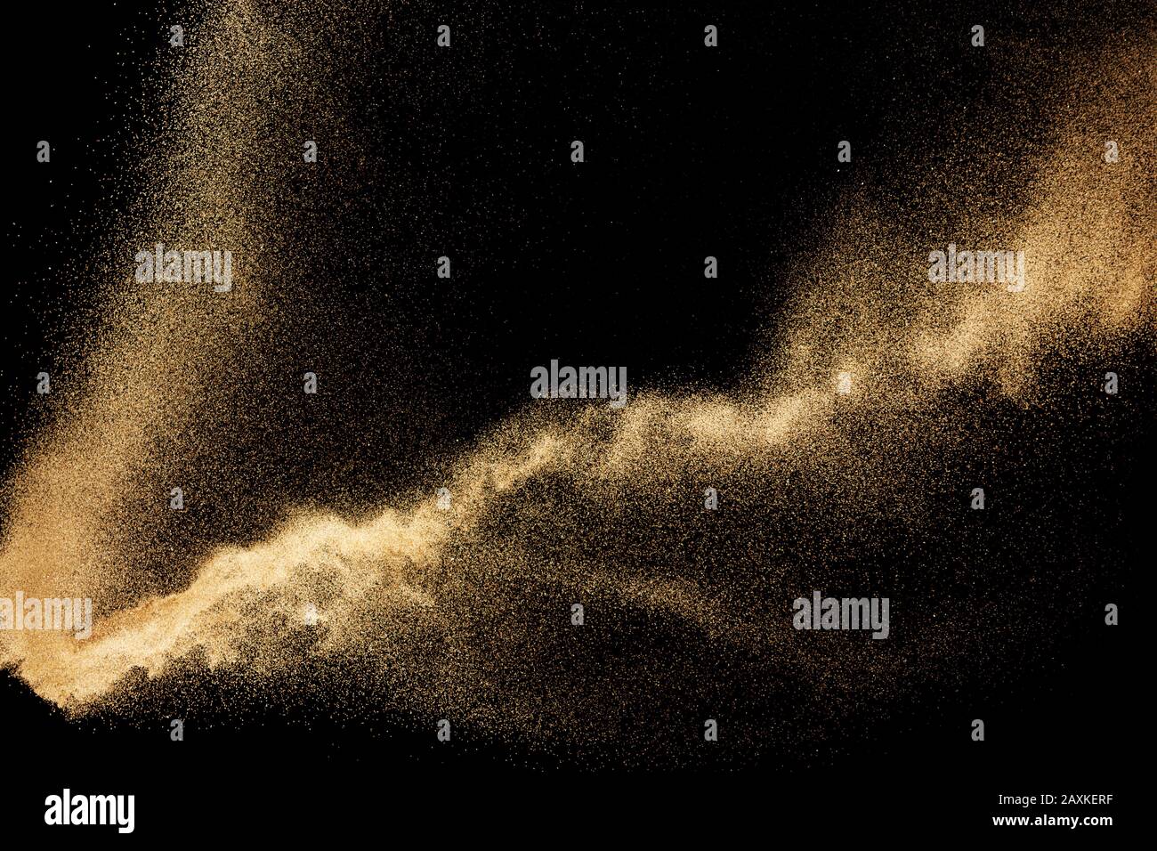 Brown colored sand splash.Dry river sand explosion isolated on black ...