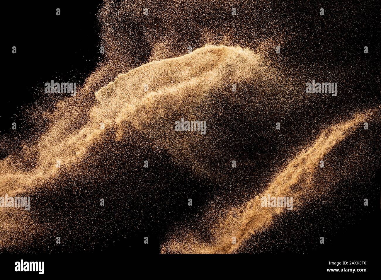 Brown colored sand splash.Dry river sand explosion isolated on black ...