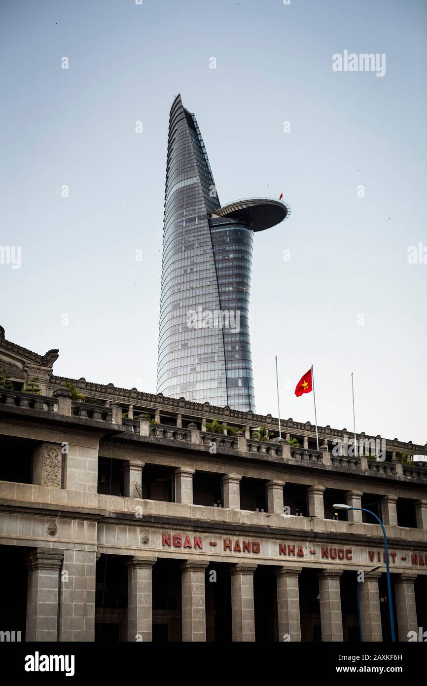 Facade of historic stone building with contemporary skyscraper in the ...