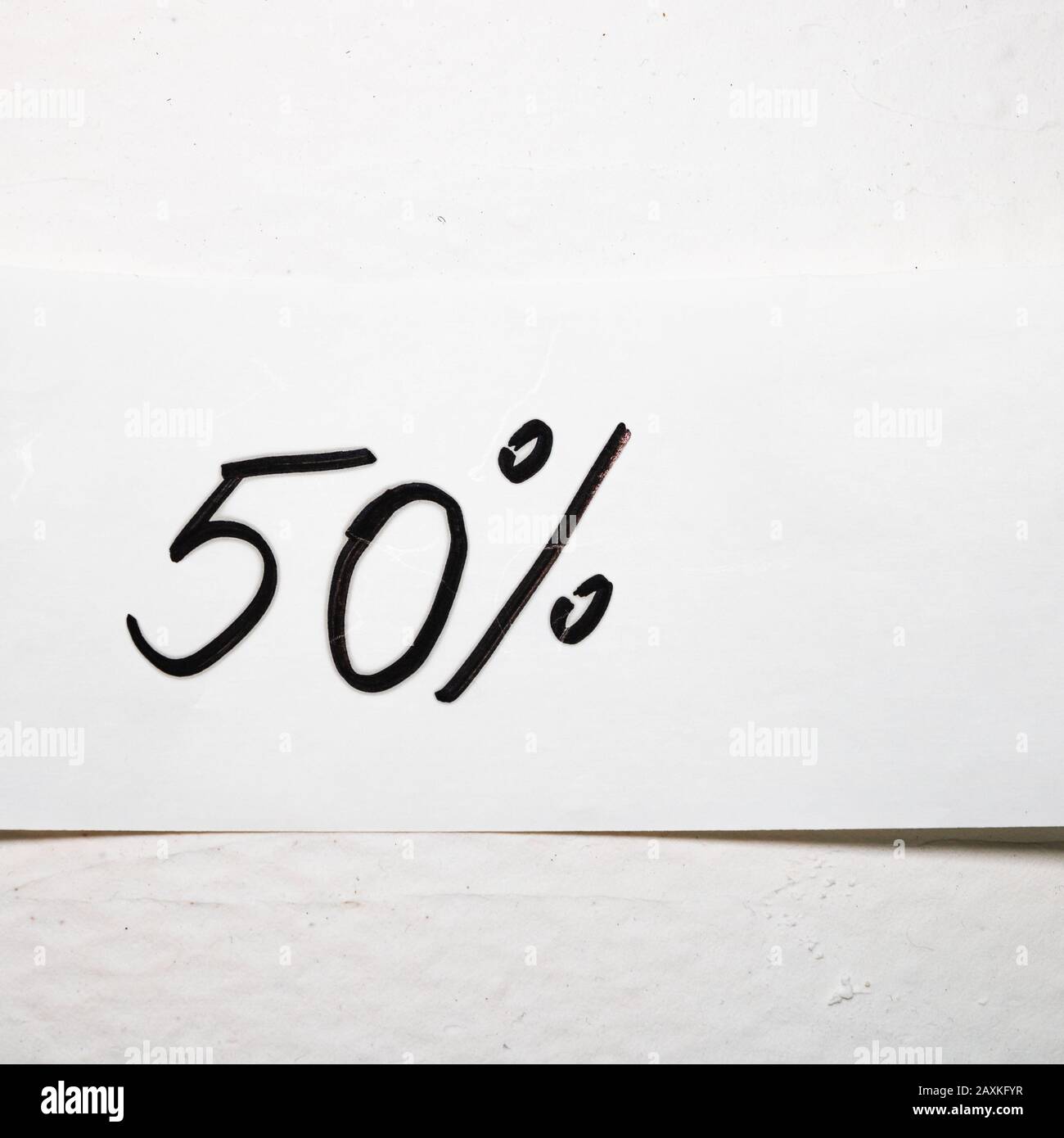 Writing 50 percent on white label on white background Stock Photo - Alamy