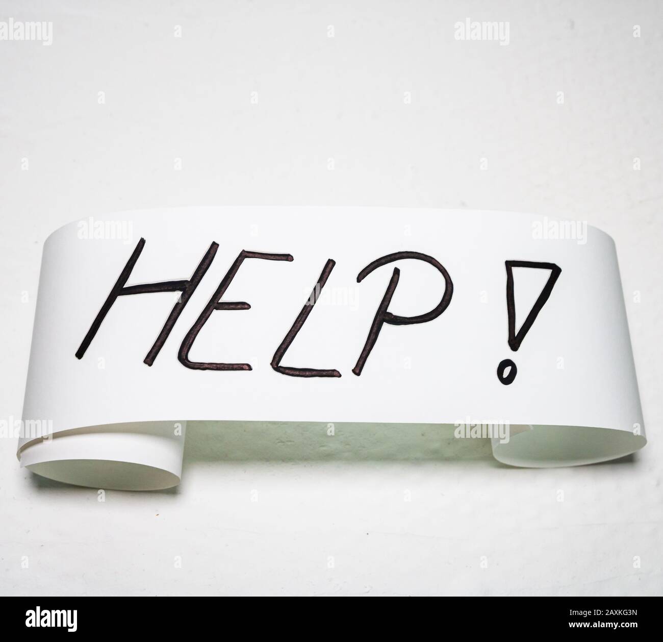 Writing help on white label on white background Stock Photo - Alamy