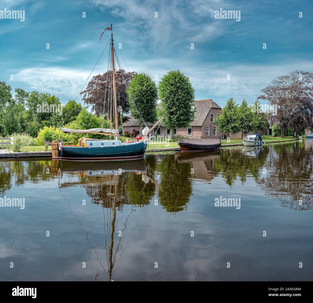 Farmhouse and a sailingboat in a canal, Rijpwetering, Zuid-Holland ...