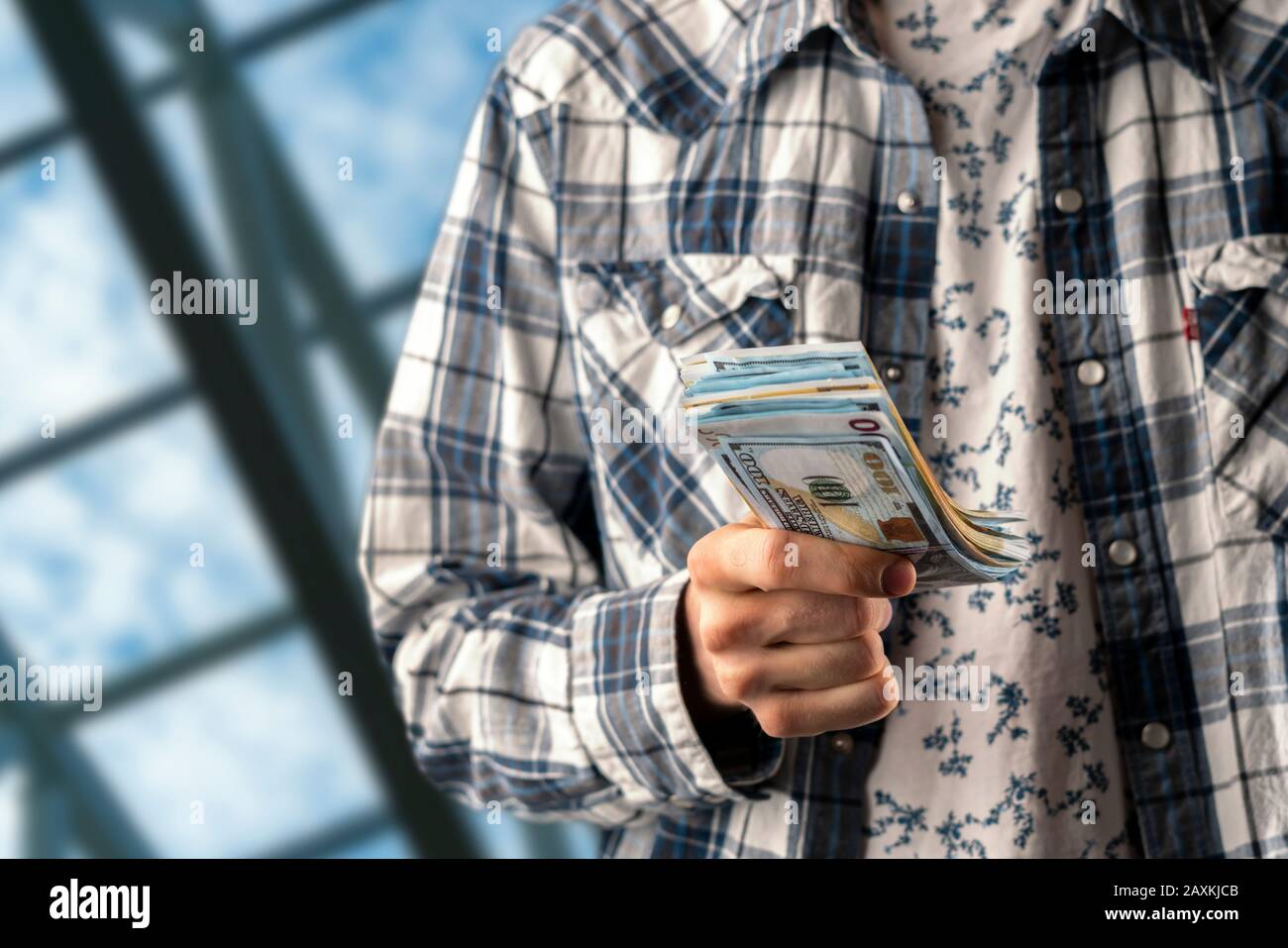 the person's hand giving you the bunch pack of cash money Stock Photo ...