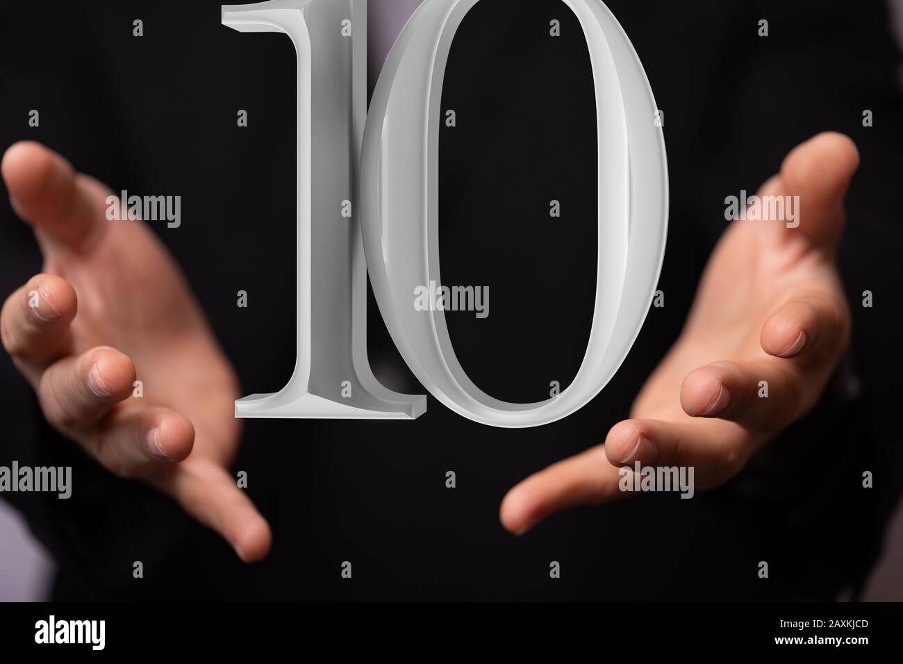 Person presenting a visual projection of a digital number ten at a ...