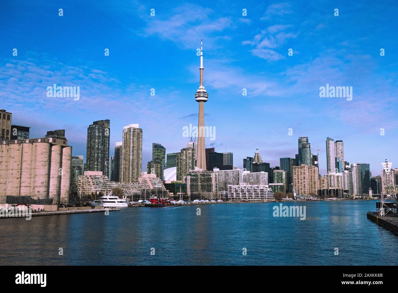 Panorama of Toronto skyline with the famous CN Tower under blue skies ...