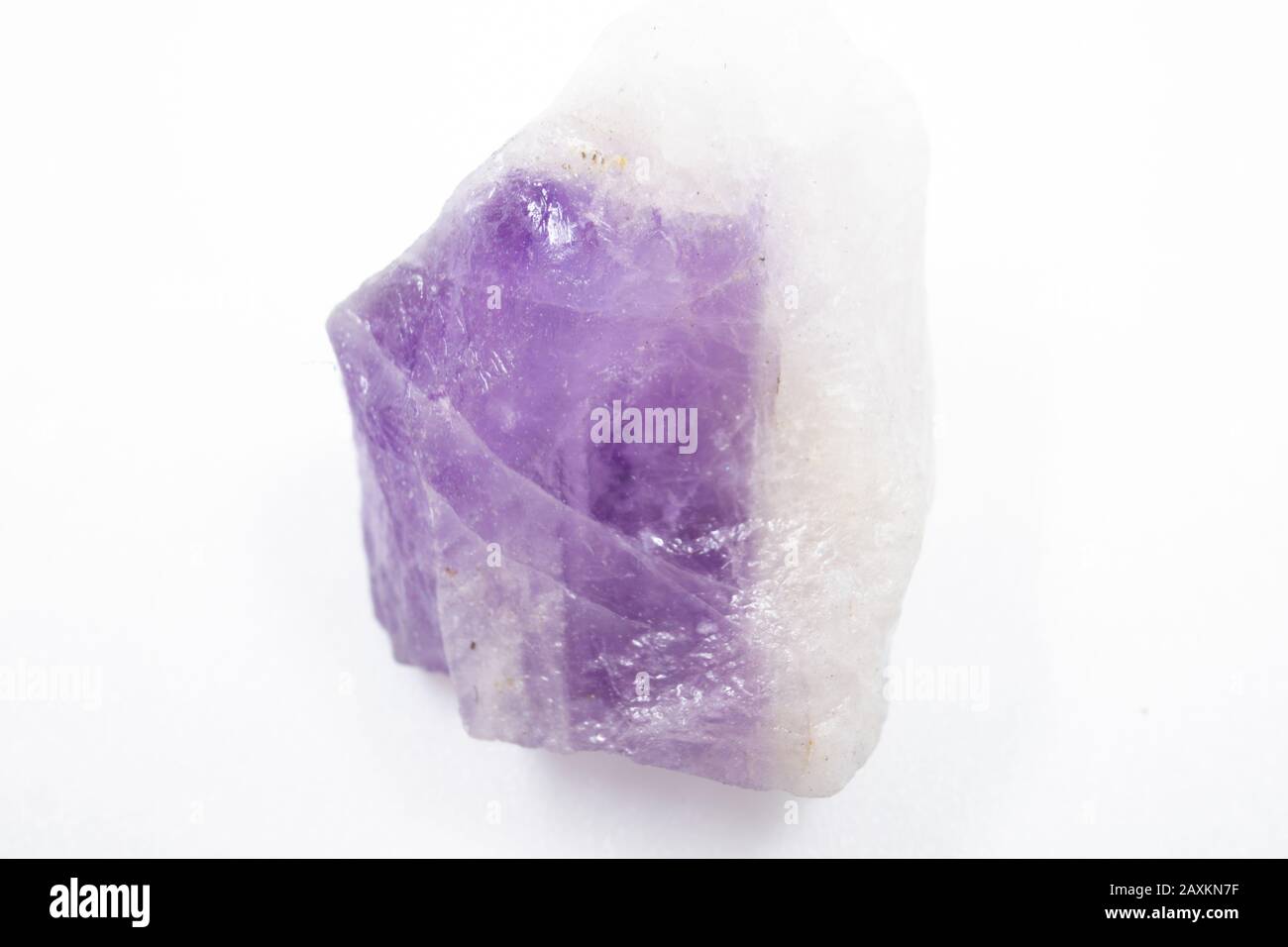 Pink natural mineral stone against a white background Stock Photo - Alamy